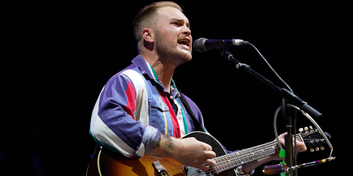 Joe Rogan Randomly Pops Up On Stage, Goes Wild At Zach Bryan Show | OutKick