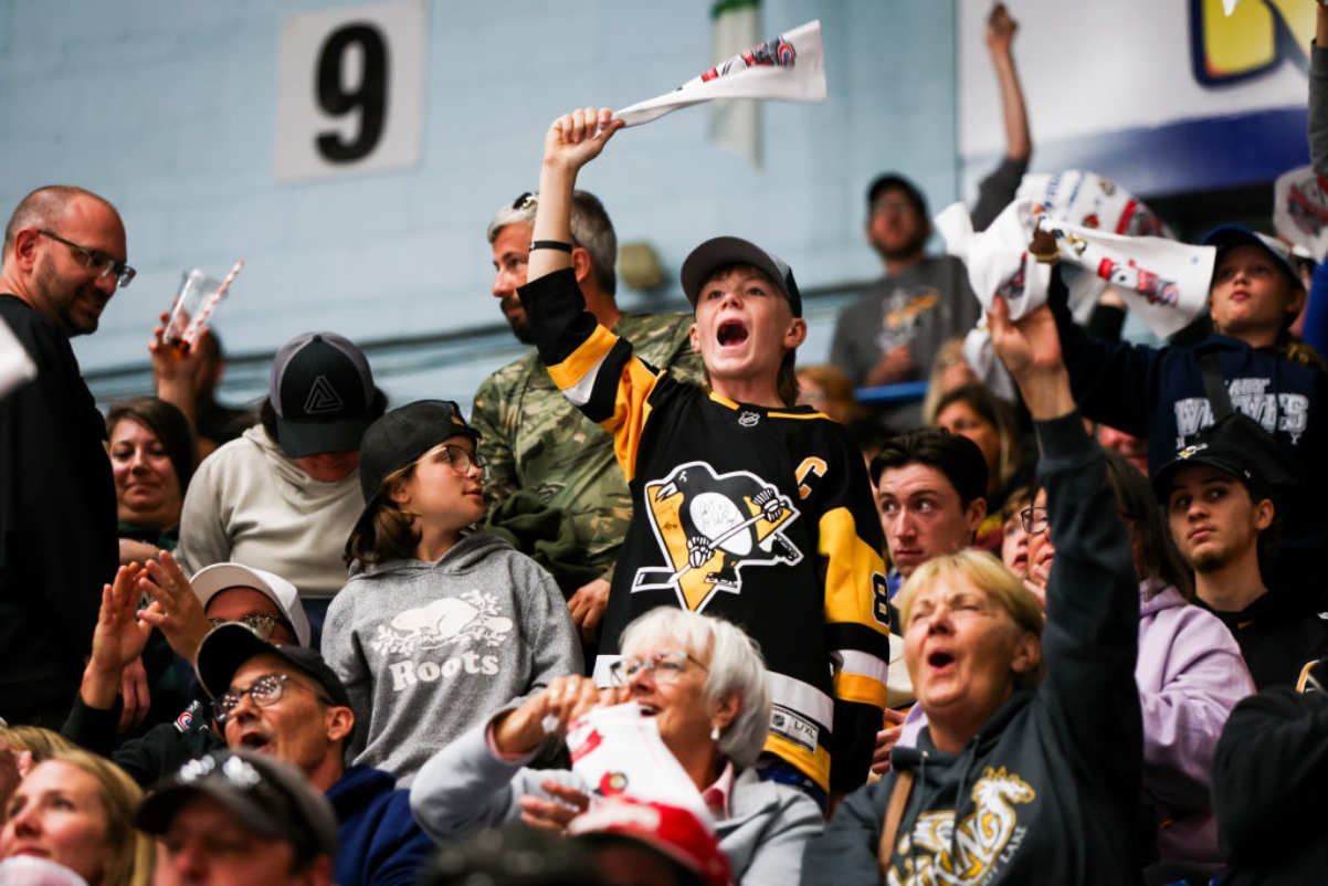 Miserable Penguins Fan Steals Puck From Kid Before Mom Saves The Day ...